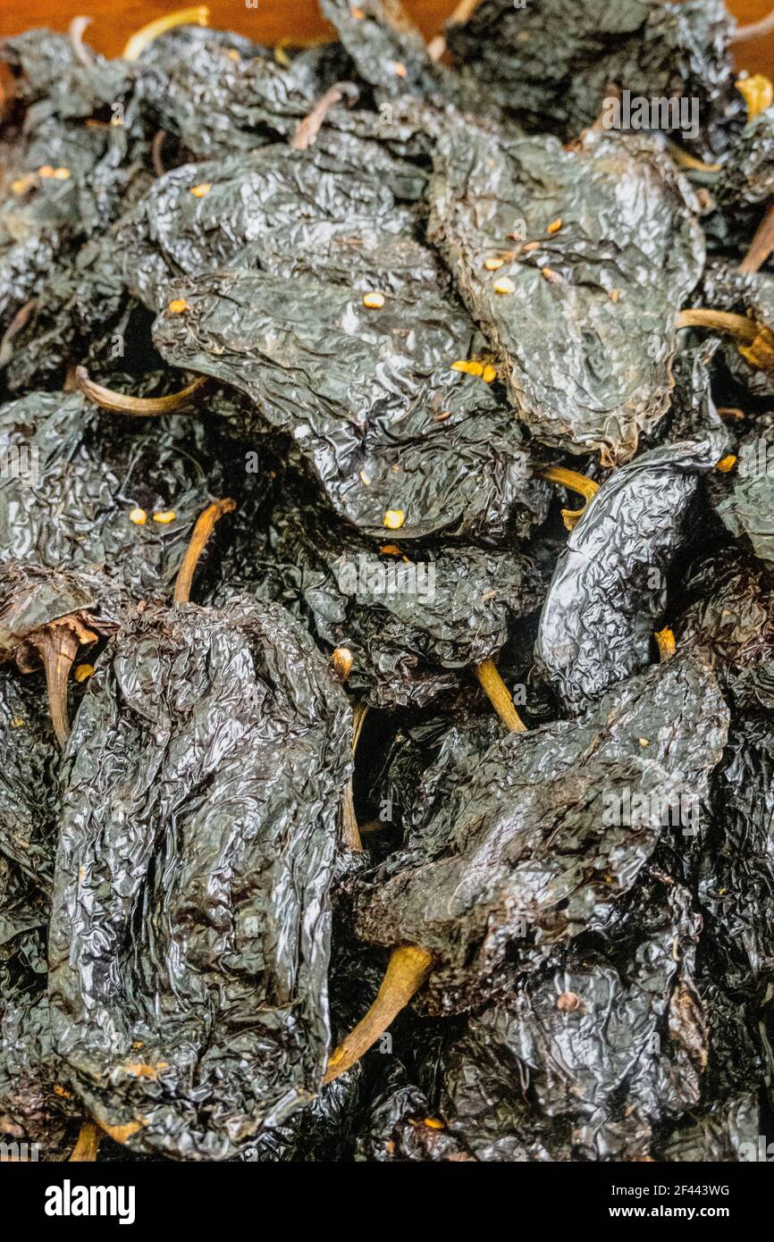 Black Chili in a pile ready for sale Stock Photo - Alamy