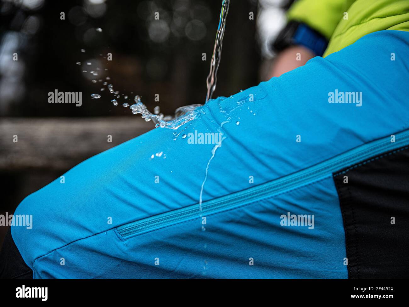 Hydrophobic effect on blue waterproof fabric on mountain trousers Stock ...