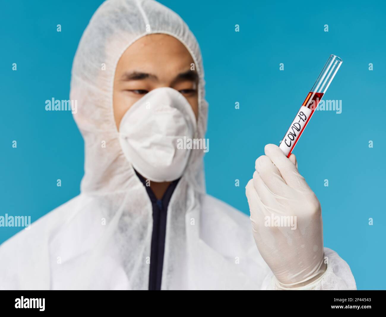 Male laboratory assistant analyzes diagnostics blood testing ...