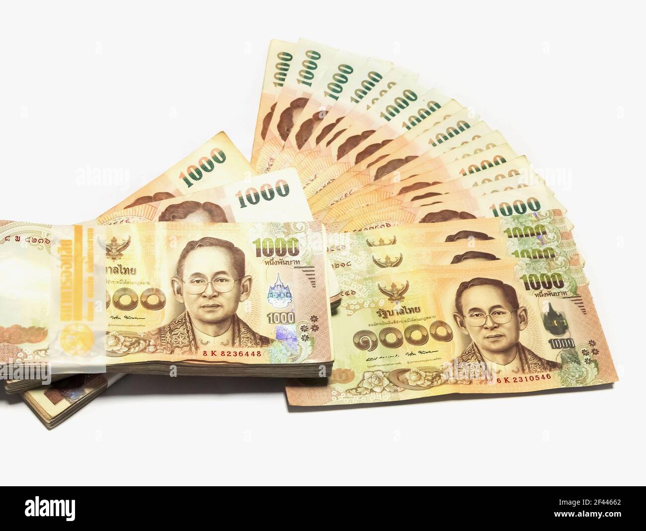 stack of Thai money banknotes baht on white background Stock Photo - Alamy