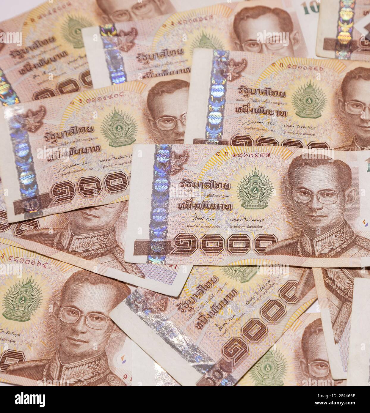 stack of Thai money banknotes baht on white background Stock Photo - Alamy