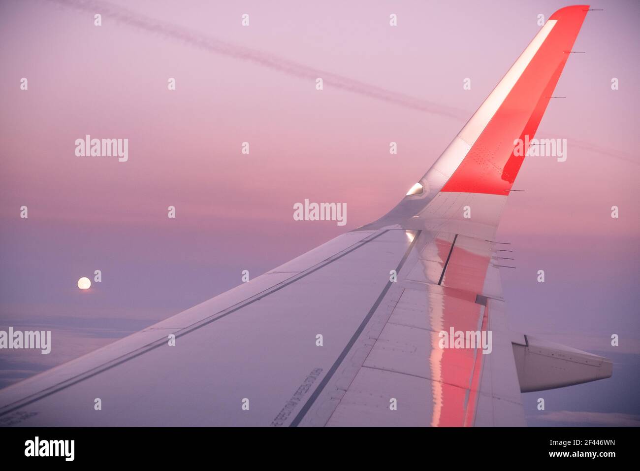 airplane window picture with sun on the horizon Stock Photo - Alamy