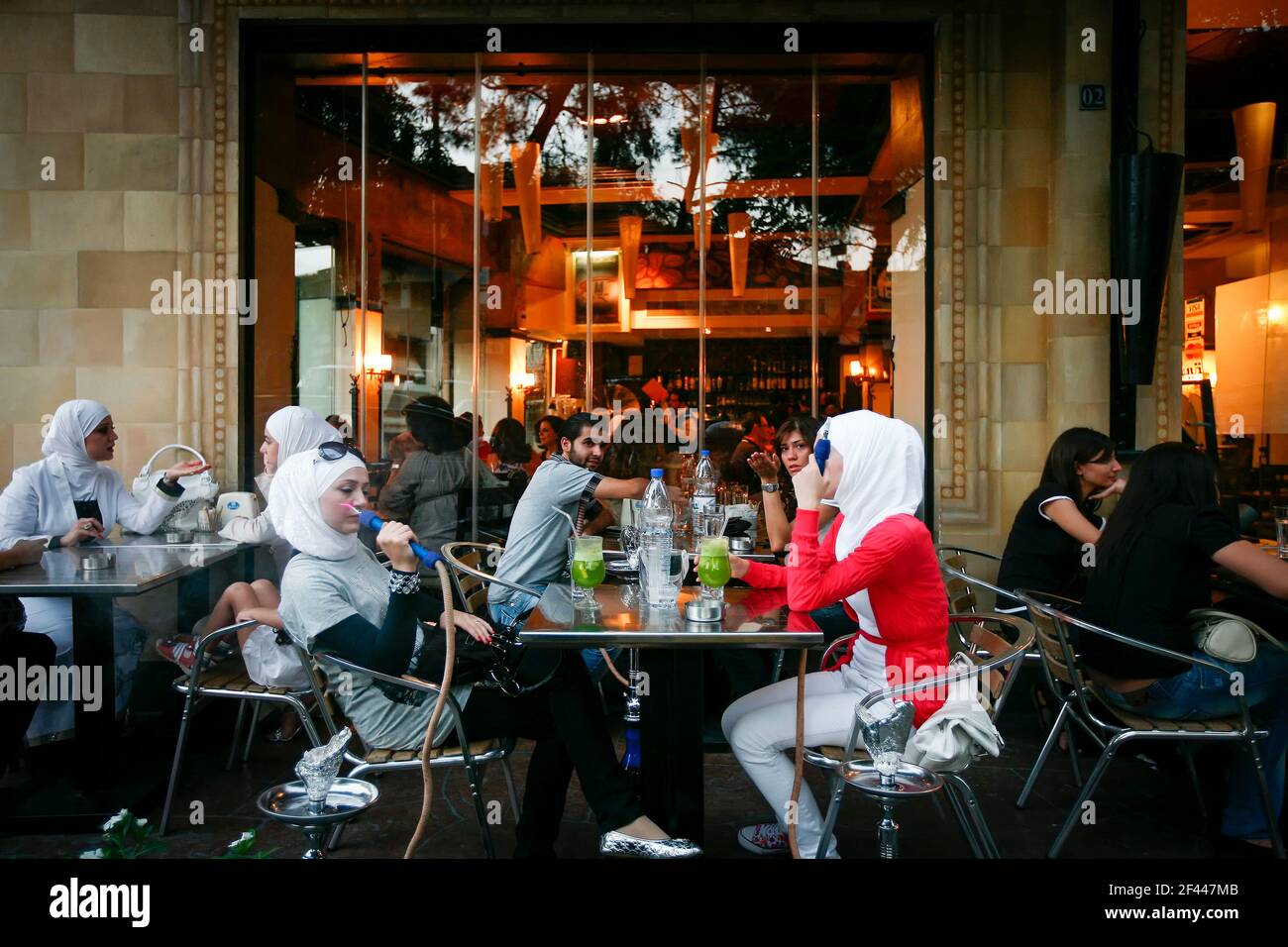 Damascus,Syria - August 03,2010 : People smoking shisha in a cafe in ...