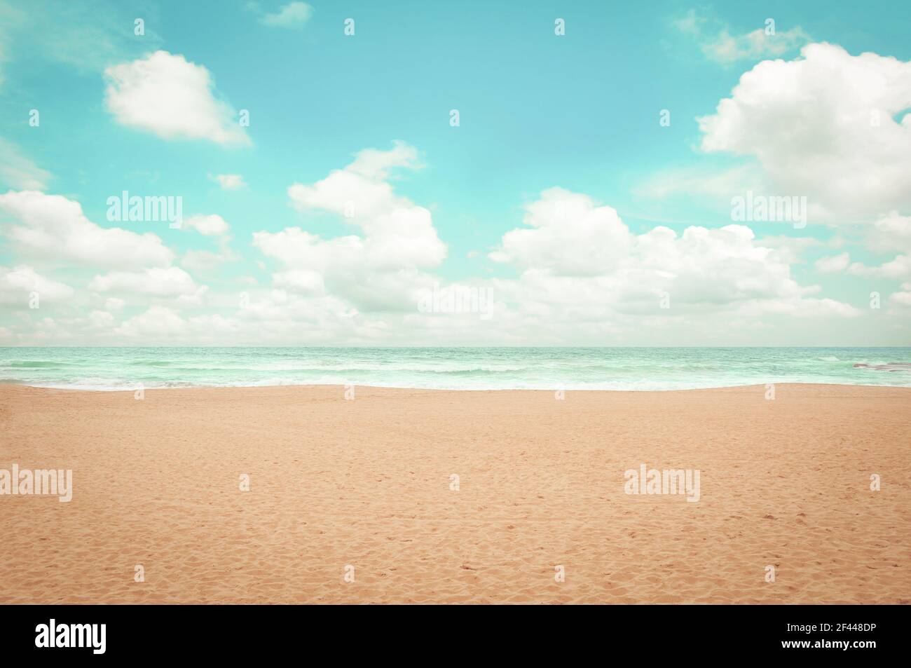 Sand beach, clouds and blue sky - retro color effect Stock Photo - Alamy