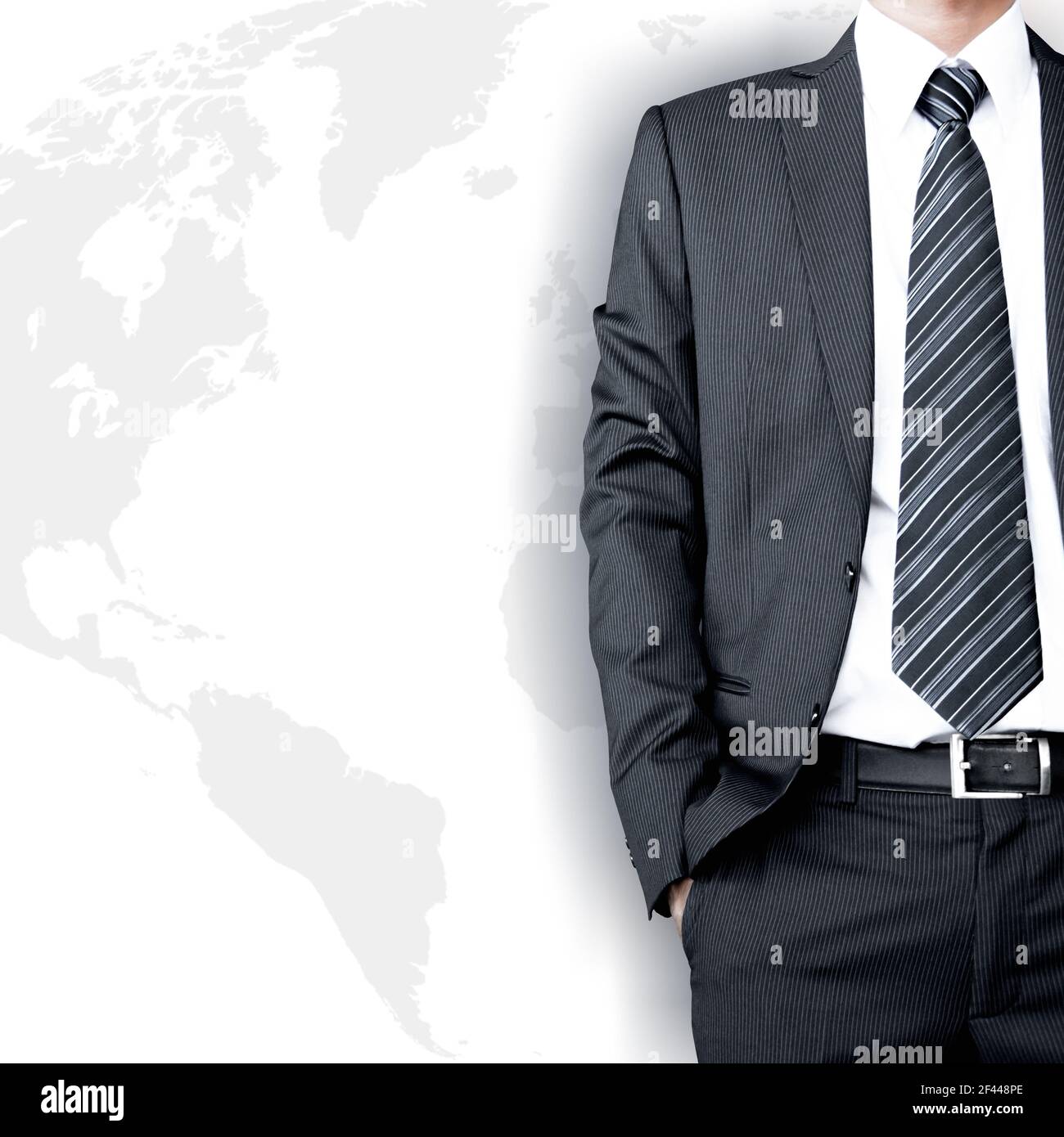 Businessman in suit & tie standing on world map background with copy ...