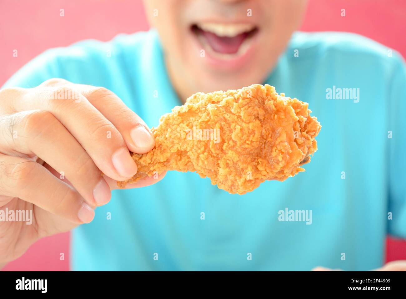 Boy eating chicken leg hi-res stock photography and images - Alamy