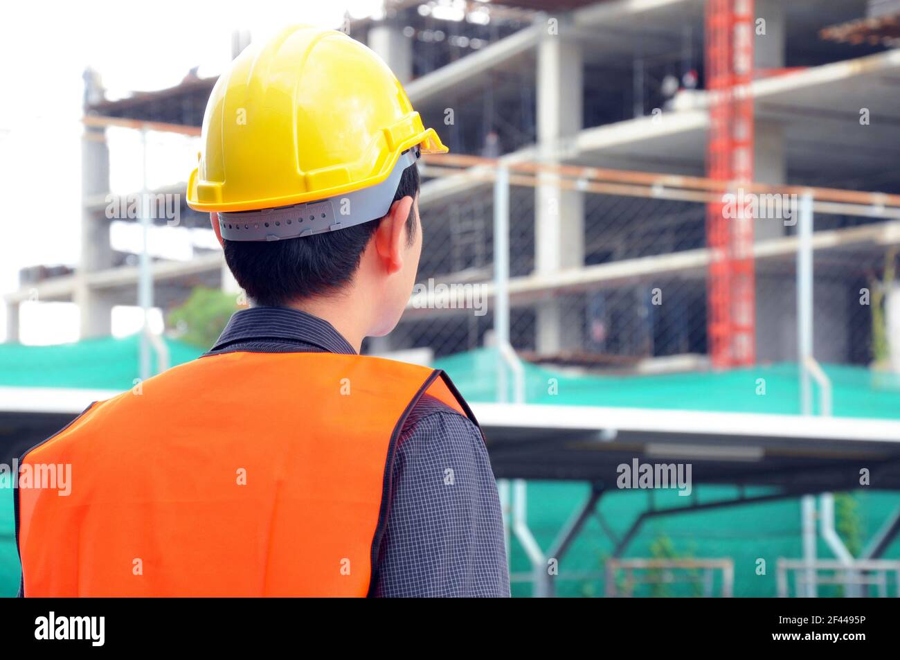 Engineer or foreman checking construction site Stock Photo - Alamy