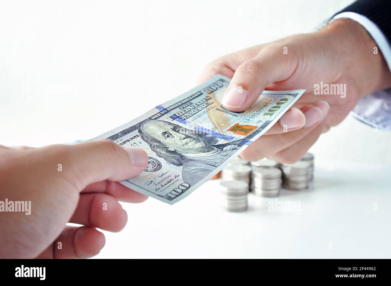 Hand giving money United States dollar (USD) bill Stock Photo - Alamy