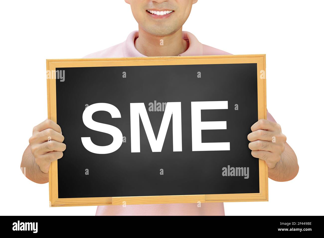 SME (or Small and Medium Enterprise ) sign on blackboard held by ...