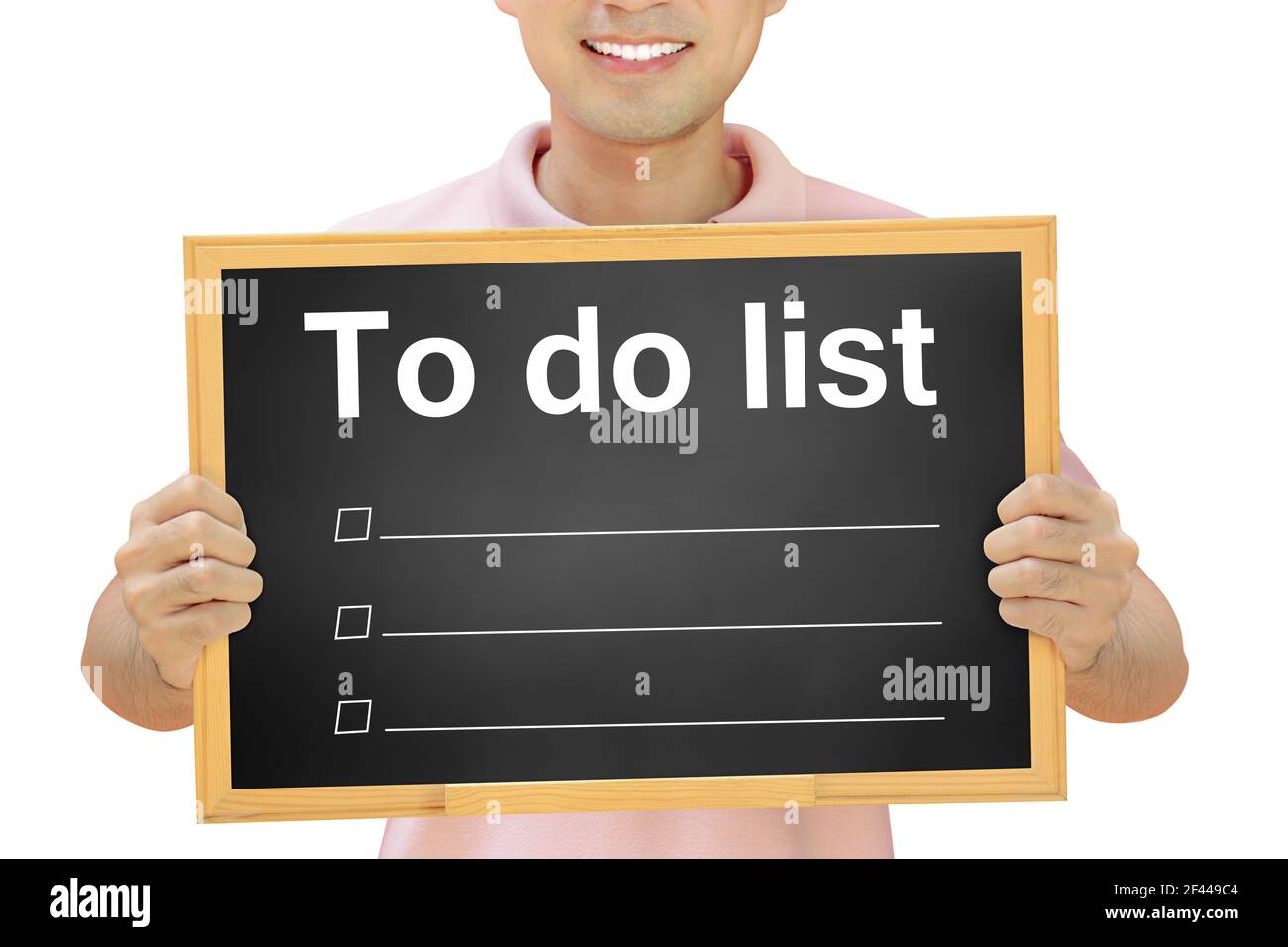 To do list on blackboard held by smiling man Stock Photo - Alamy