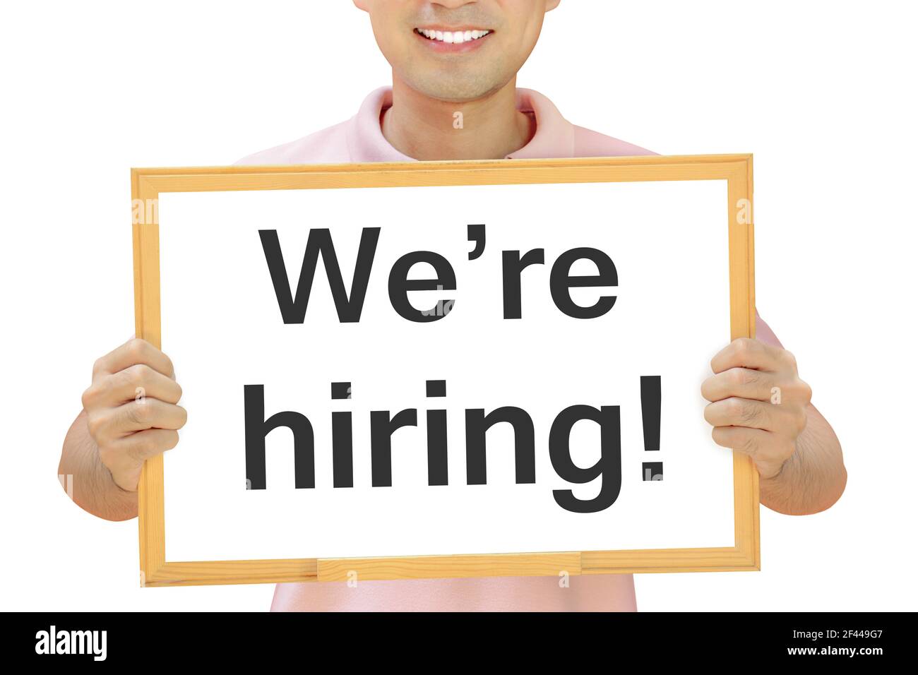 We're hiring sign on white board held by smiling man Stock Photo - Alamy