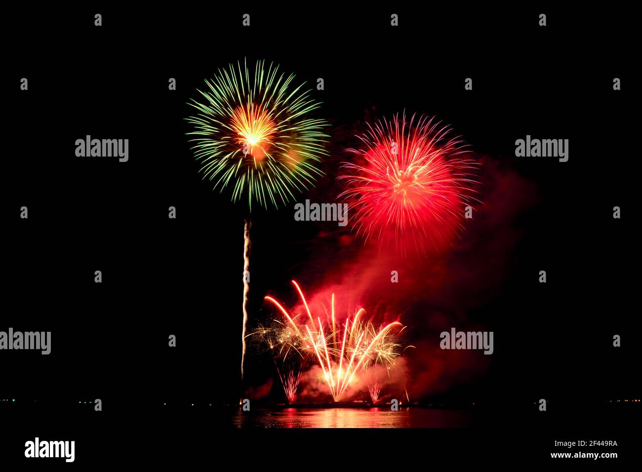Colorful green fireworks explode hi-res stock photography and images ...