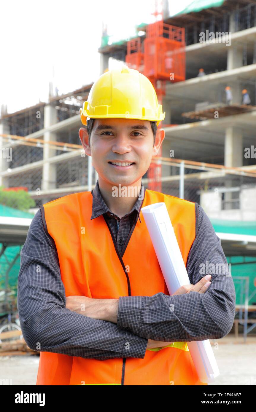 Asian engineer or foreman in front of construction site Stock Photo - Alamy