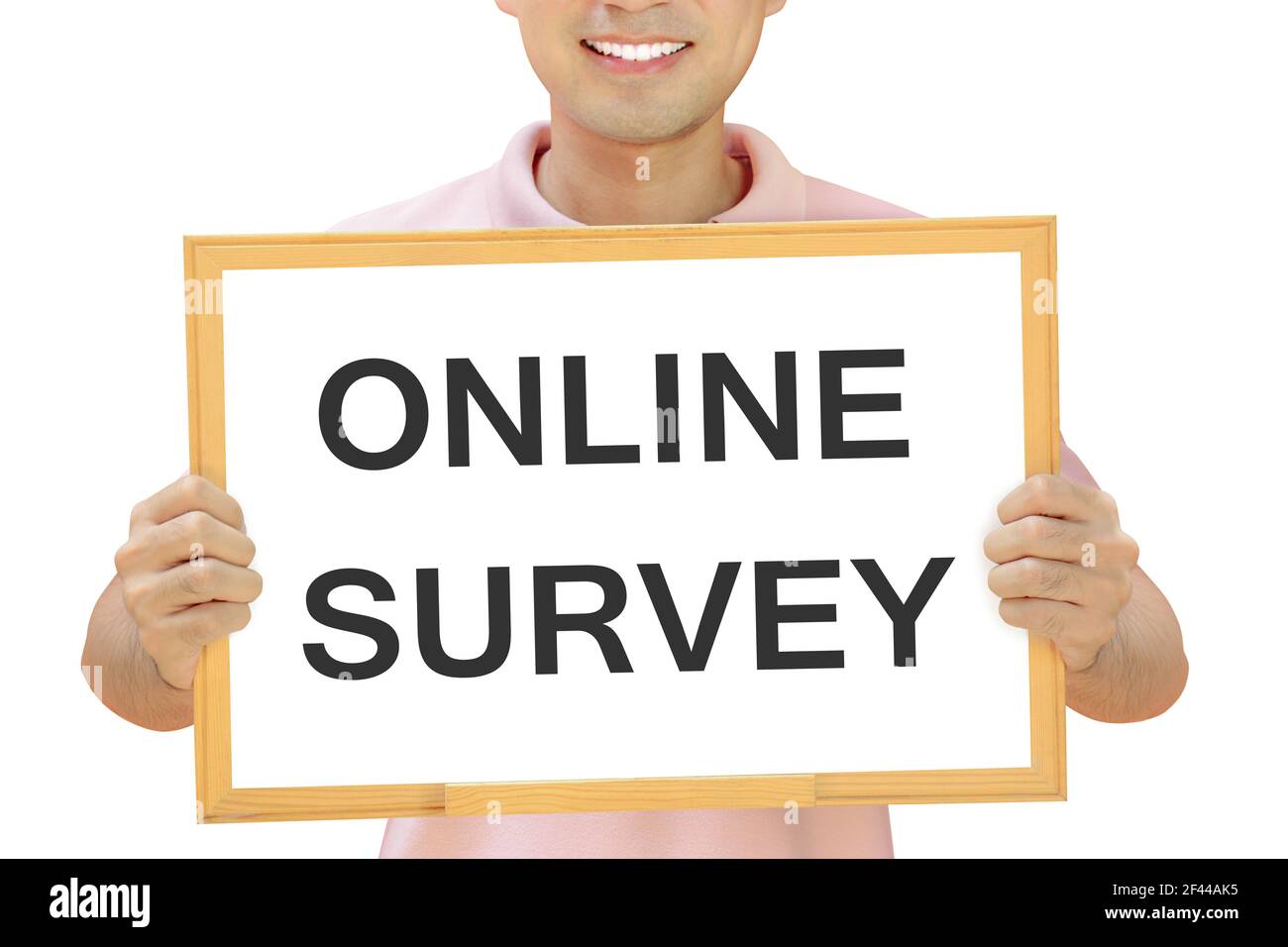 ONLINE SURVEY text on whiteboard held by smiling Stock Photo - Alamy