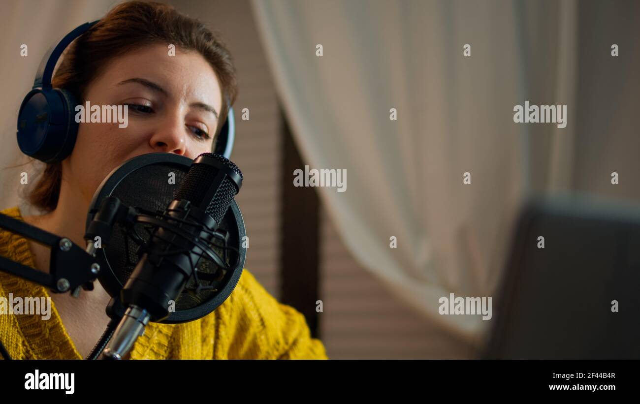 Woman checking sound before recording hi-res stock photography and ...