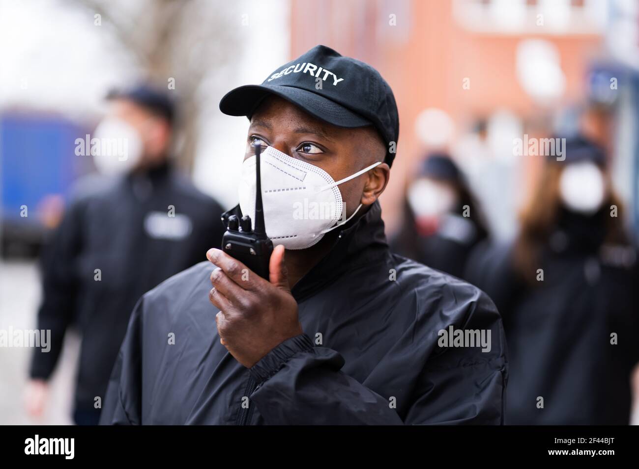 Security Officer Staff Group At Event In Face Mask Stock Photo - Alamy