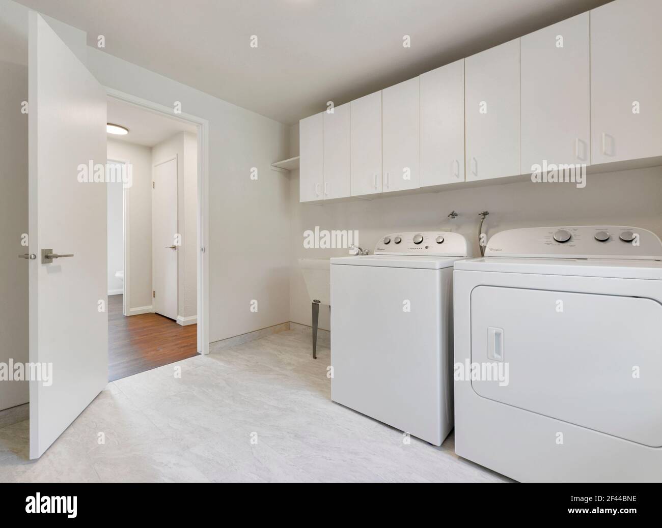 Modern residential laundry room interior Stock Photo - Alamy