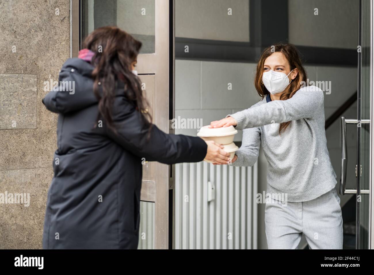 Neighbor Giving Rescue Food Help In Face Mask Stock Photo - Alamy