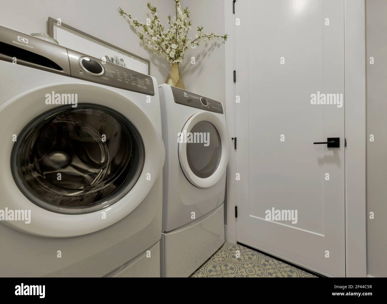 Modern residential laundry room interior Stock Photo - Alamy