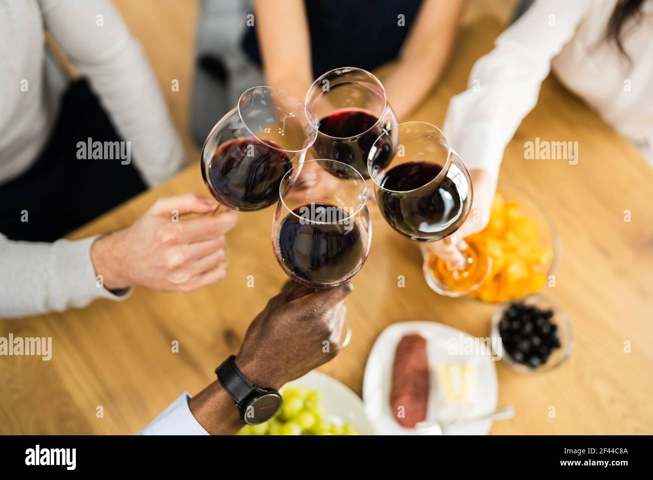 Fun People Food Party. Friends Having Dinner Stock Photo - Alamy
