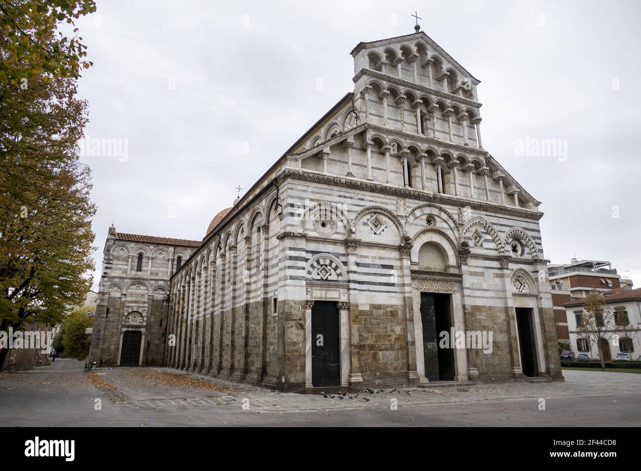 A side view of the old Roman Catholic church on a gloomy day in the ...