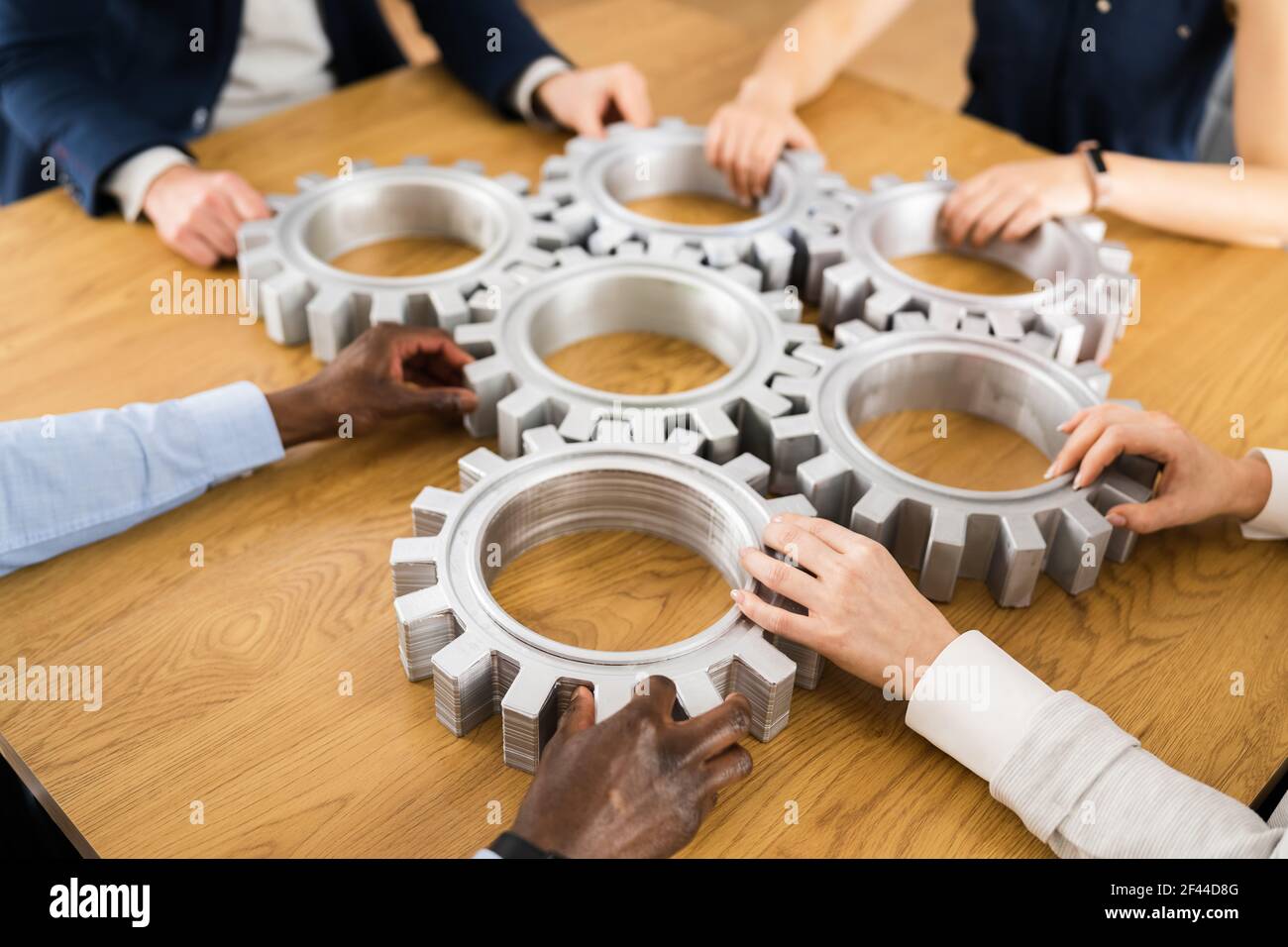 Businesspeople Hands Joining Gears. Support And Implementation Stock ...