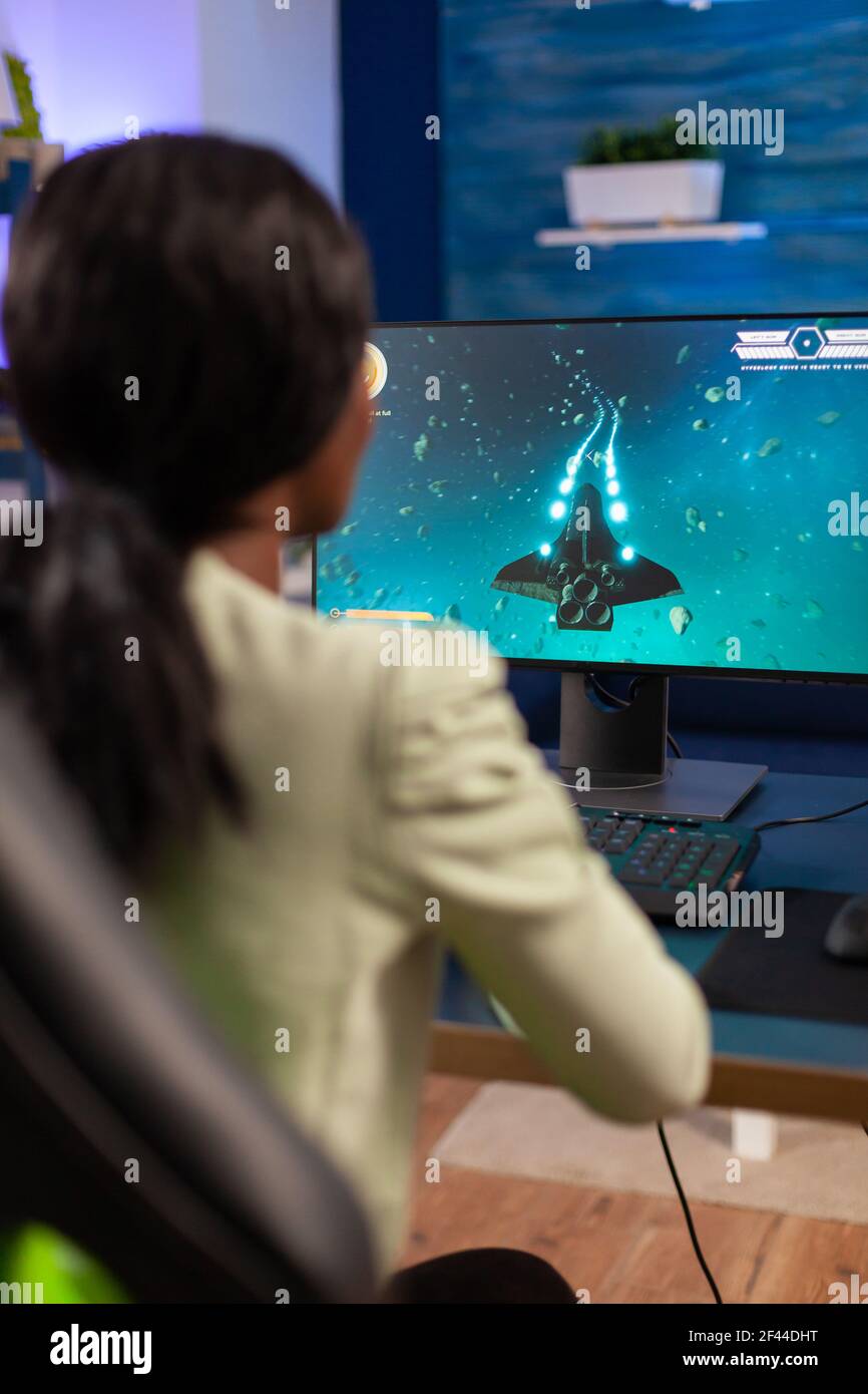 Professional esports gamer player during online championship with ...