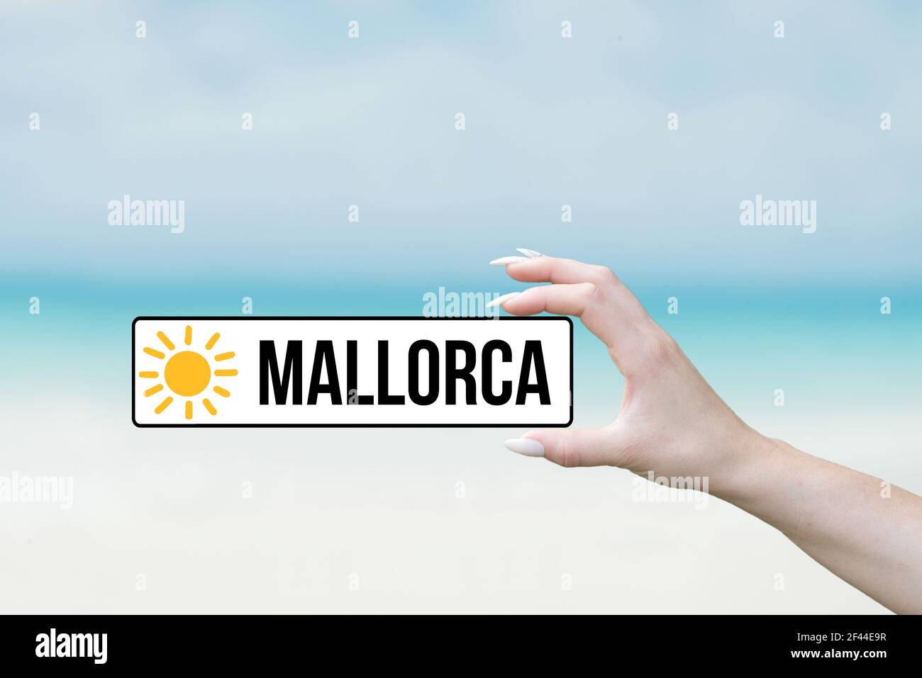 Beach, vacation and a woman with the sign Mallorca Stock Photo - Alamy