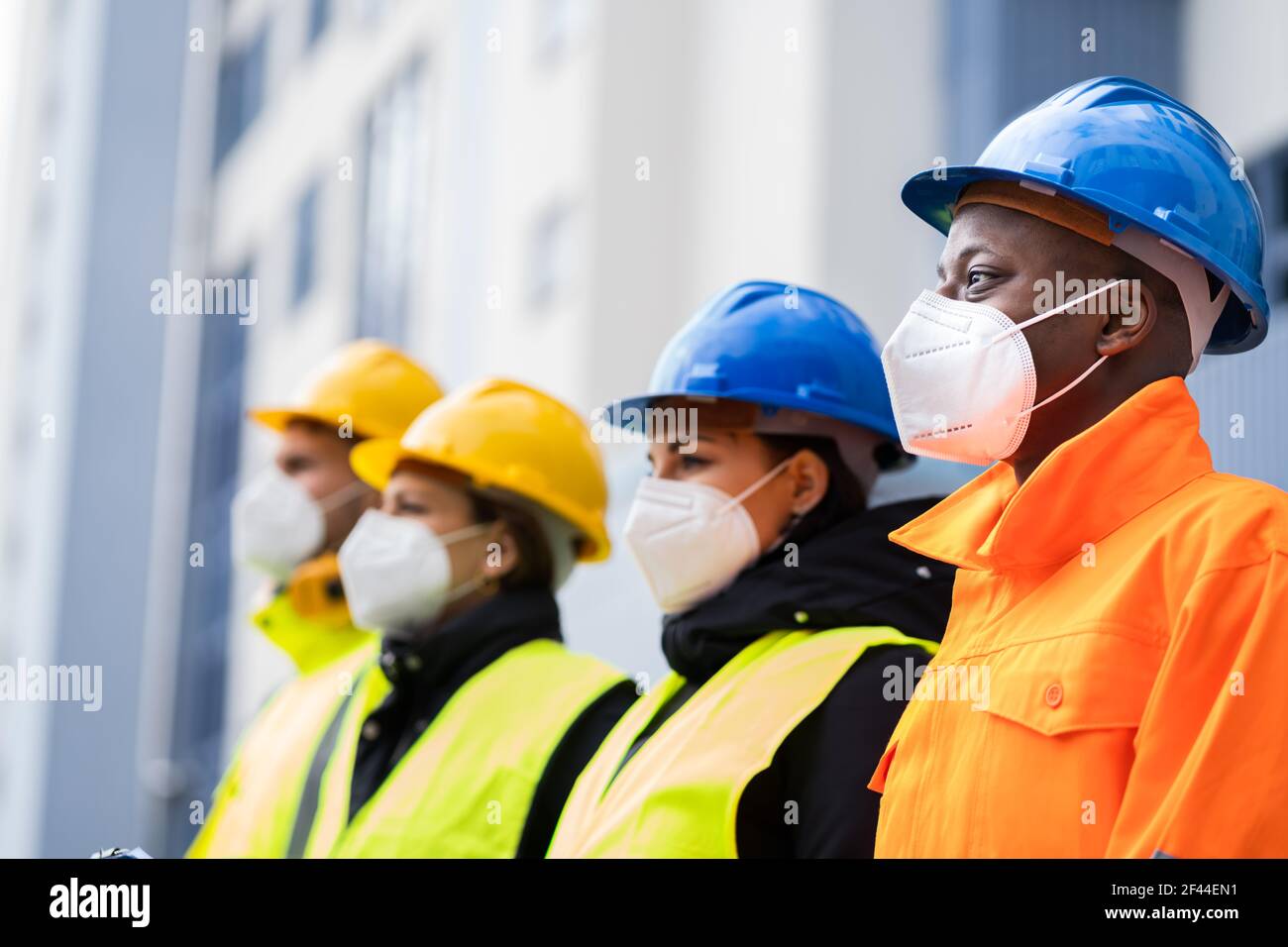 Factory Engineers Or Construction Workers In Face Mask Stock Photo - Alamy