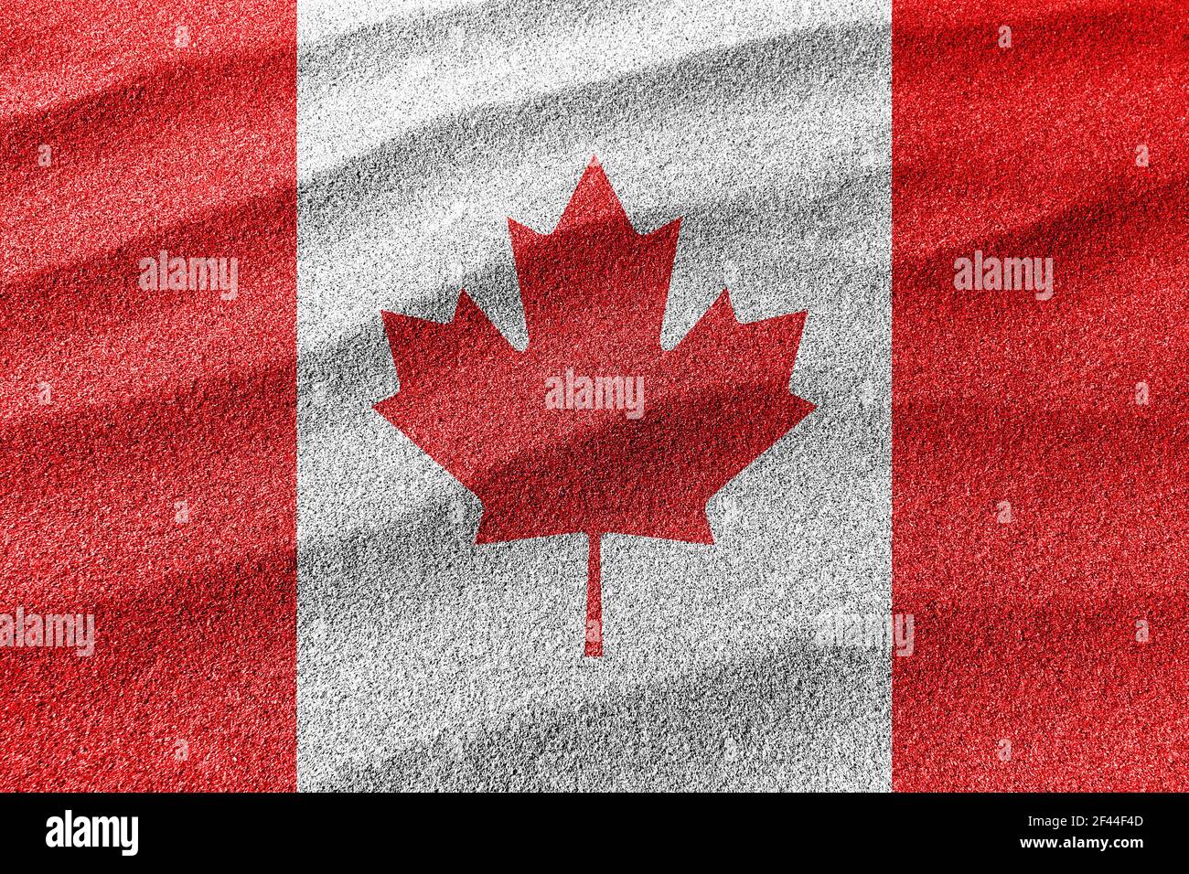 Canada sand flag, national flag sand background Stock Photo - Alamy