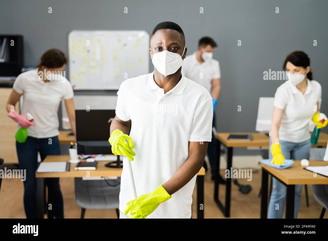 Cleaning Janitor Team Cleaner Group In Face Mask Stock Photo - Alamy