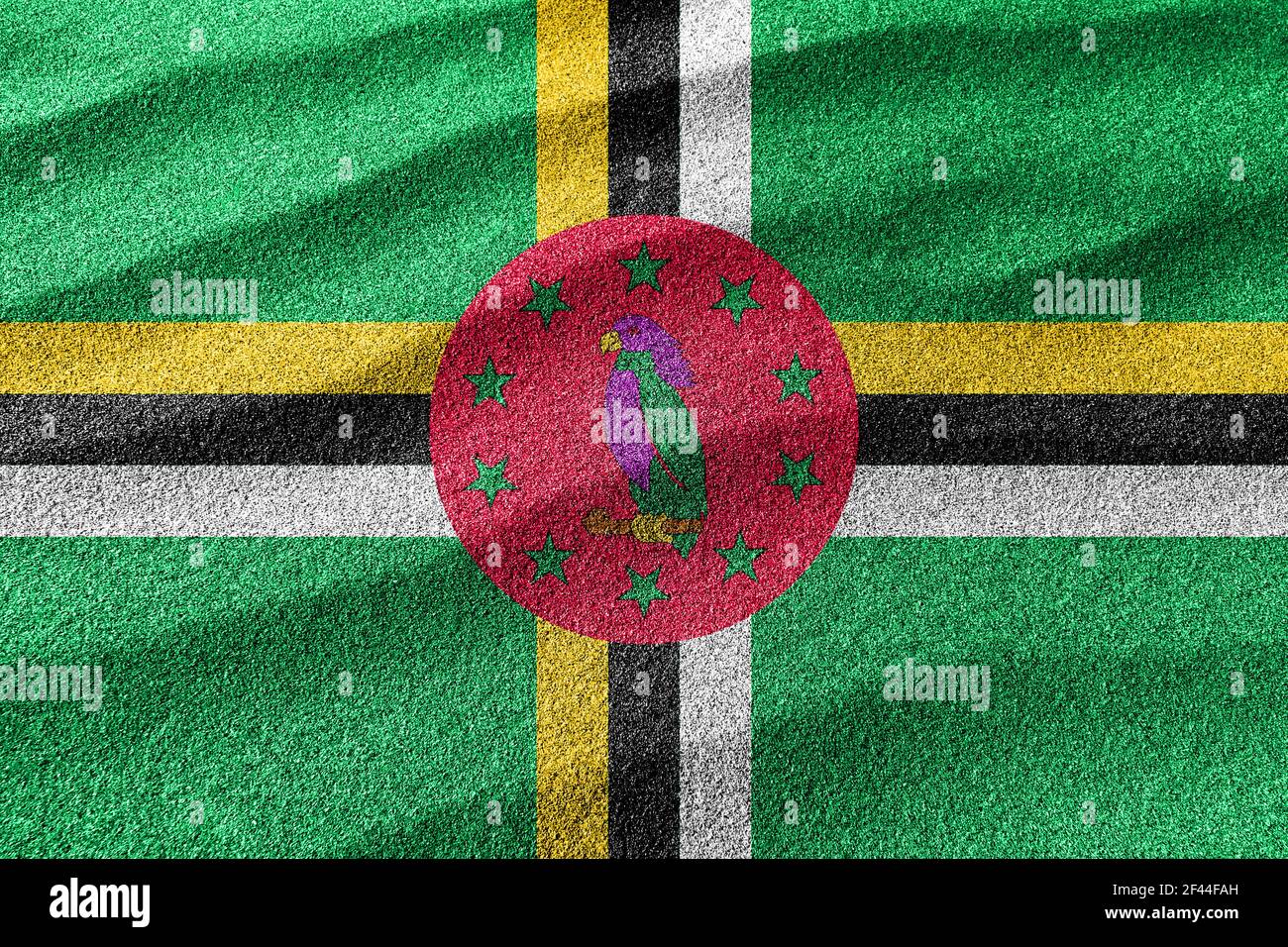 Dominica sand flag, national flag sand background Stock Photo - Alamy