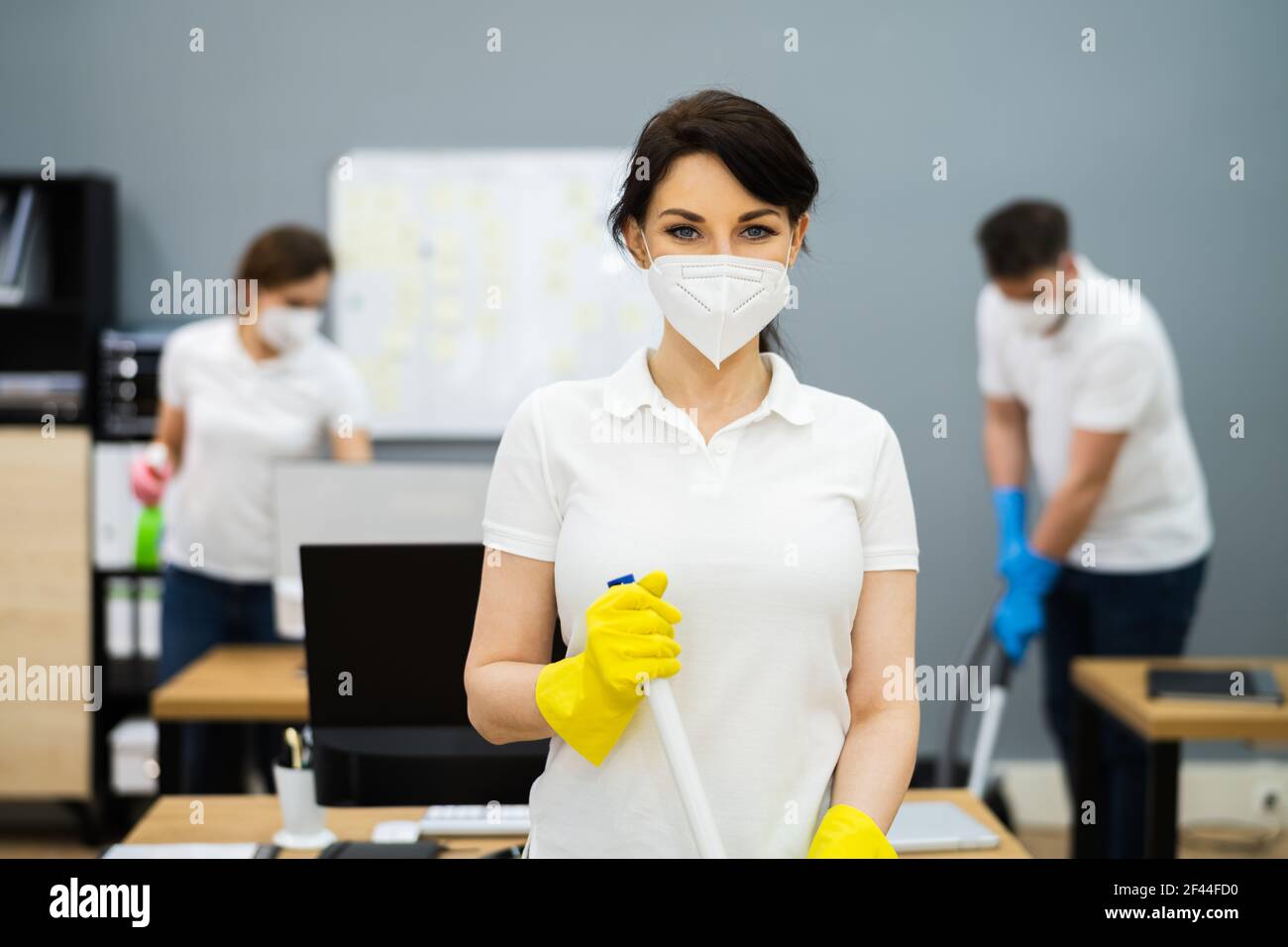 Cleaning Janitor Team Cleaner Group In Face Mask Stock Photo - Alamy