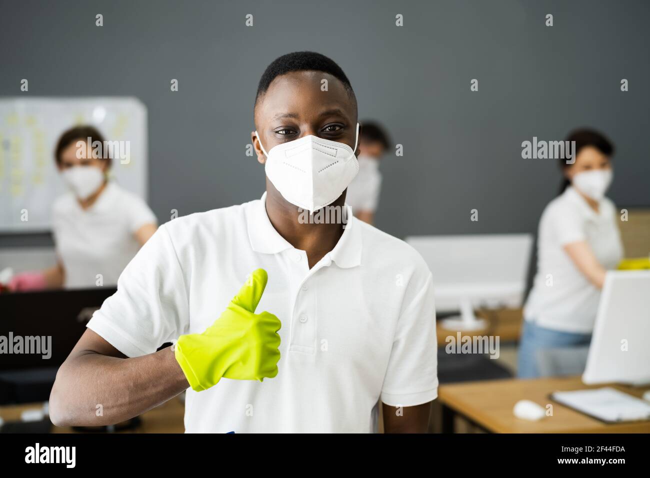 Cleaning Janitor Team Cleaner Group In Face Mask Stock Photo - Alamy