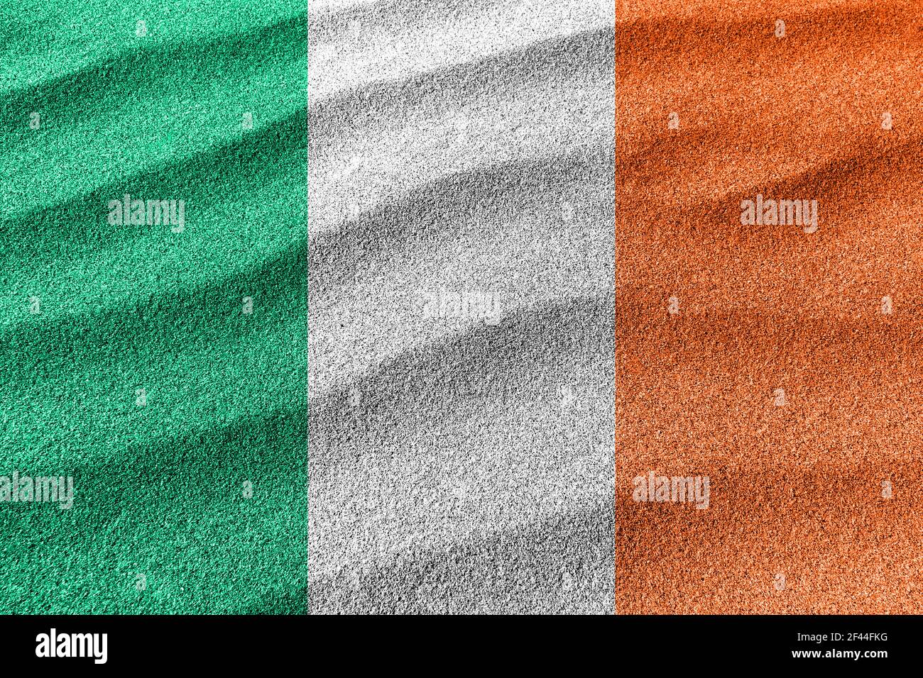 Ireland sand flag, national flag sand background Stock Photo - Alamy