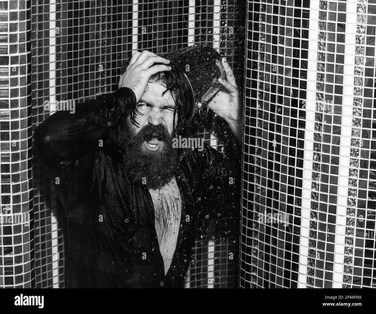 Man with bucket in shower Stock Photo - Alamy
