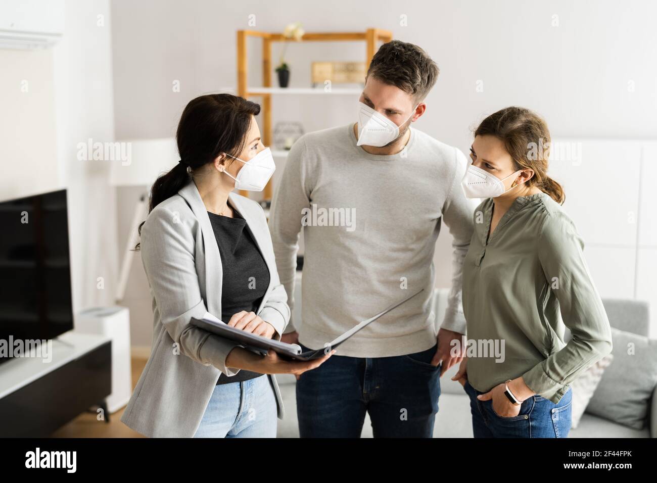 Buying Real Estate House Wearing Covid Mask Stock Photo - Alamy