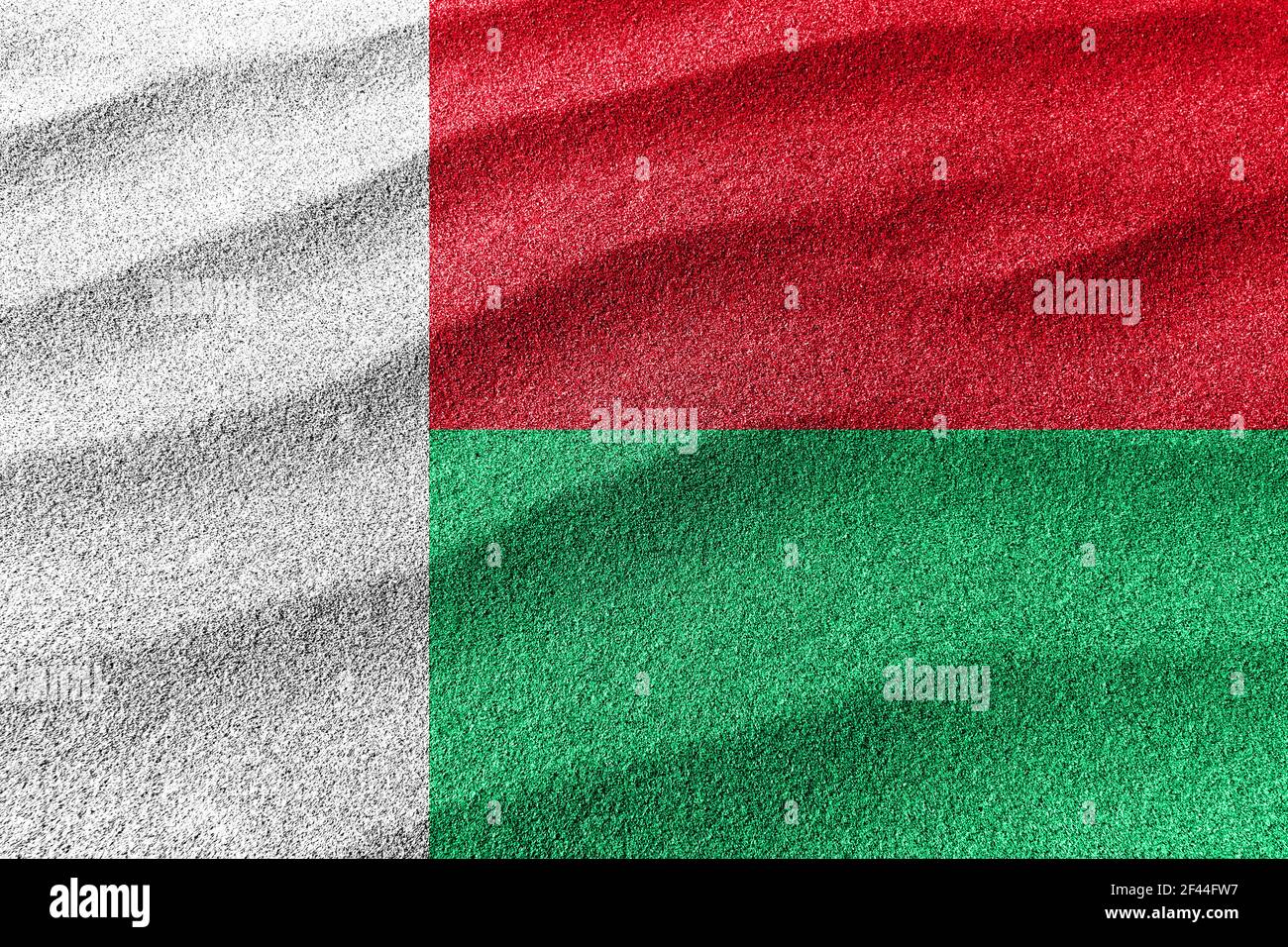 Madagascar sand flag, national flag sand background Stock Photo - Alamy