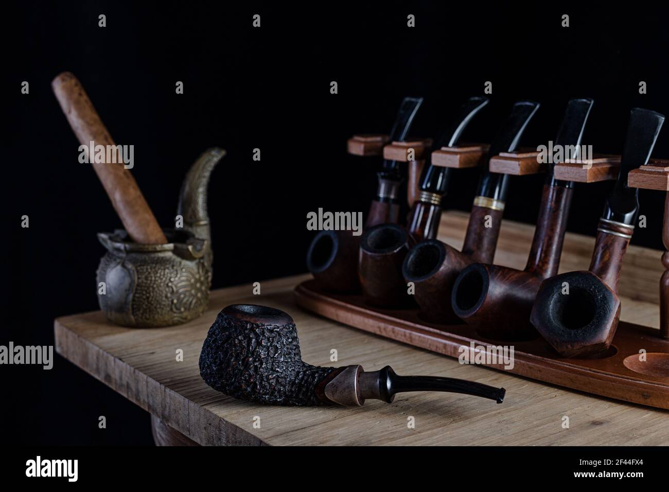Smoking pipes of different shapes and types in a special rack Stock ...