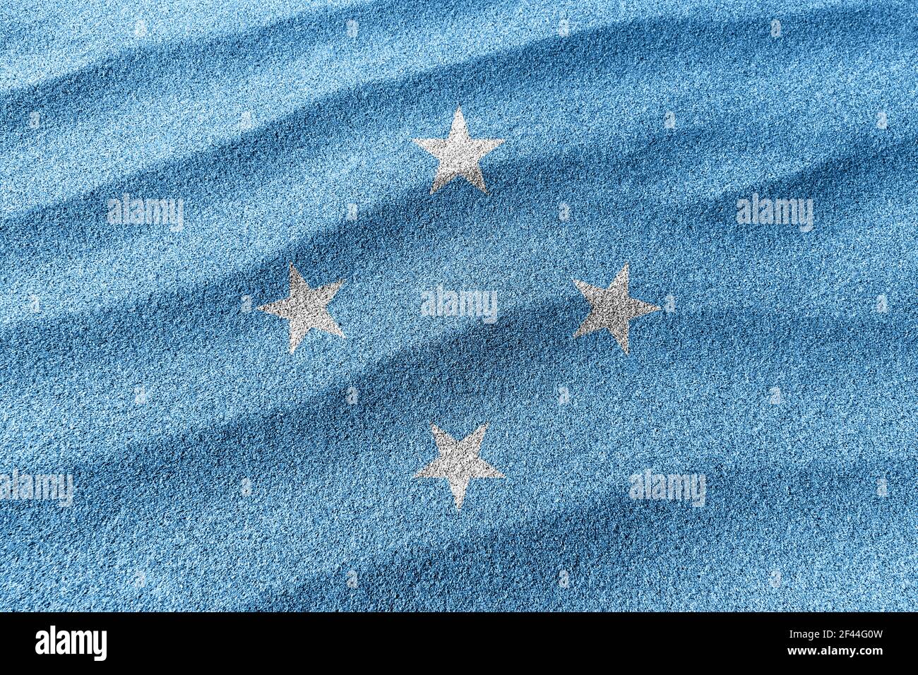 Micronesia sand flag, national flag sand background Stock Photo - Alamy