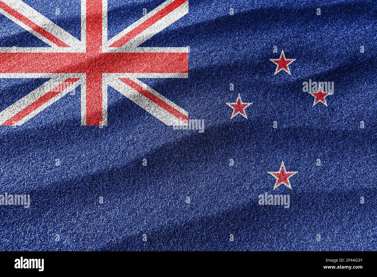 New Zealand sand flag, national flag sand background Stock Photo - Alamy