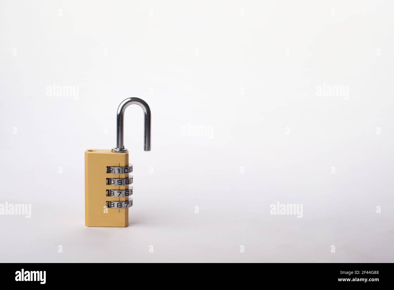 A golden combination lock isolated on white background Stock Photo - Alamy