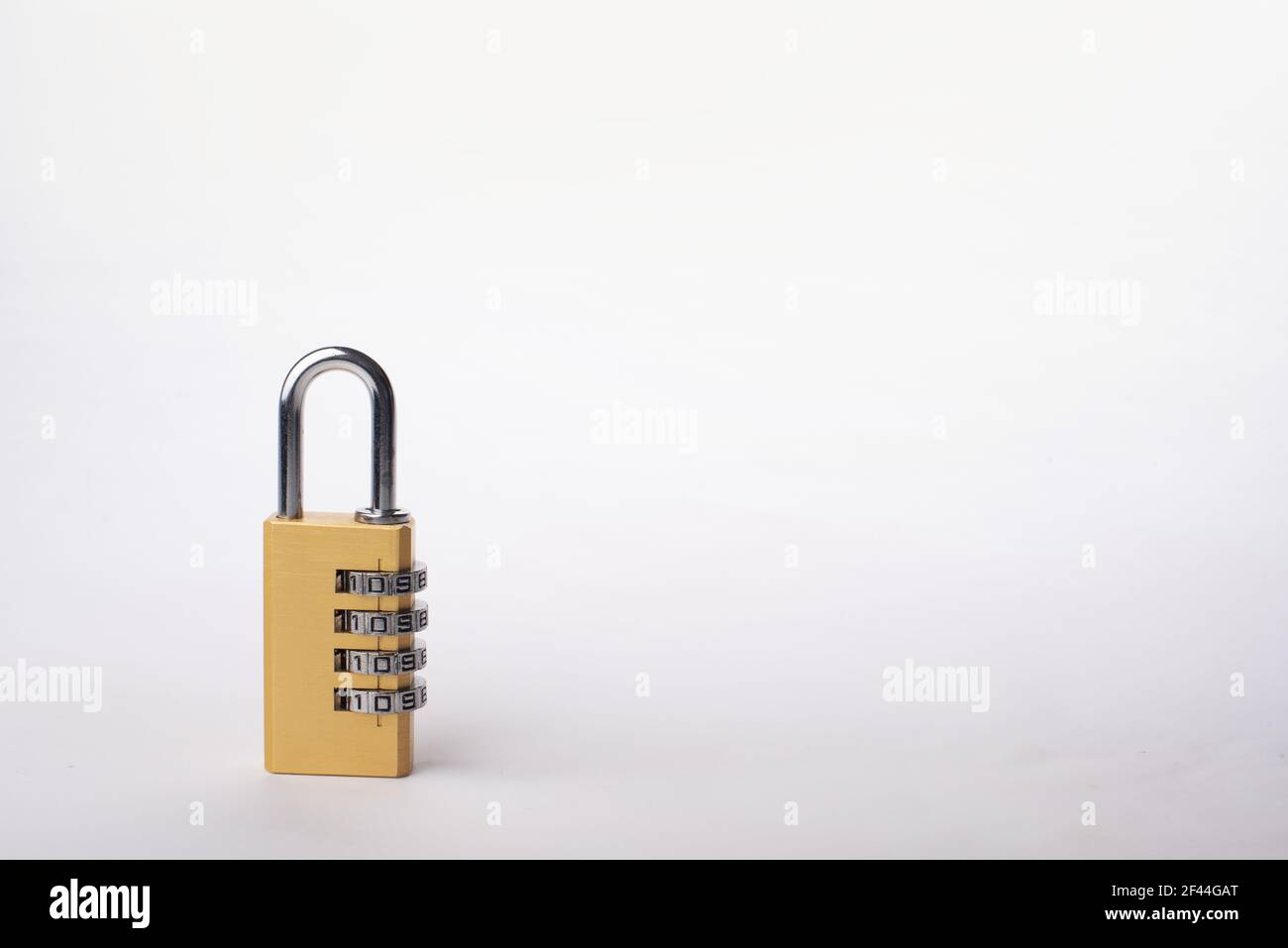 A golden combination lock isolated on white background Stock Photo - Alamy