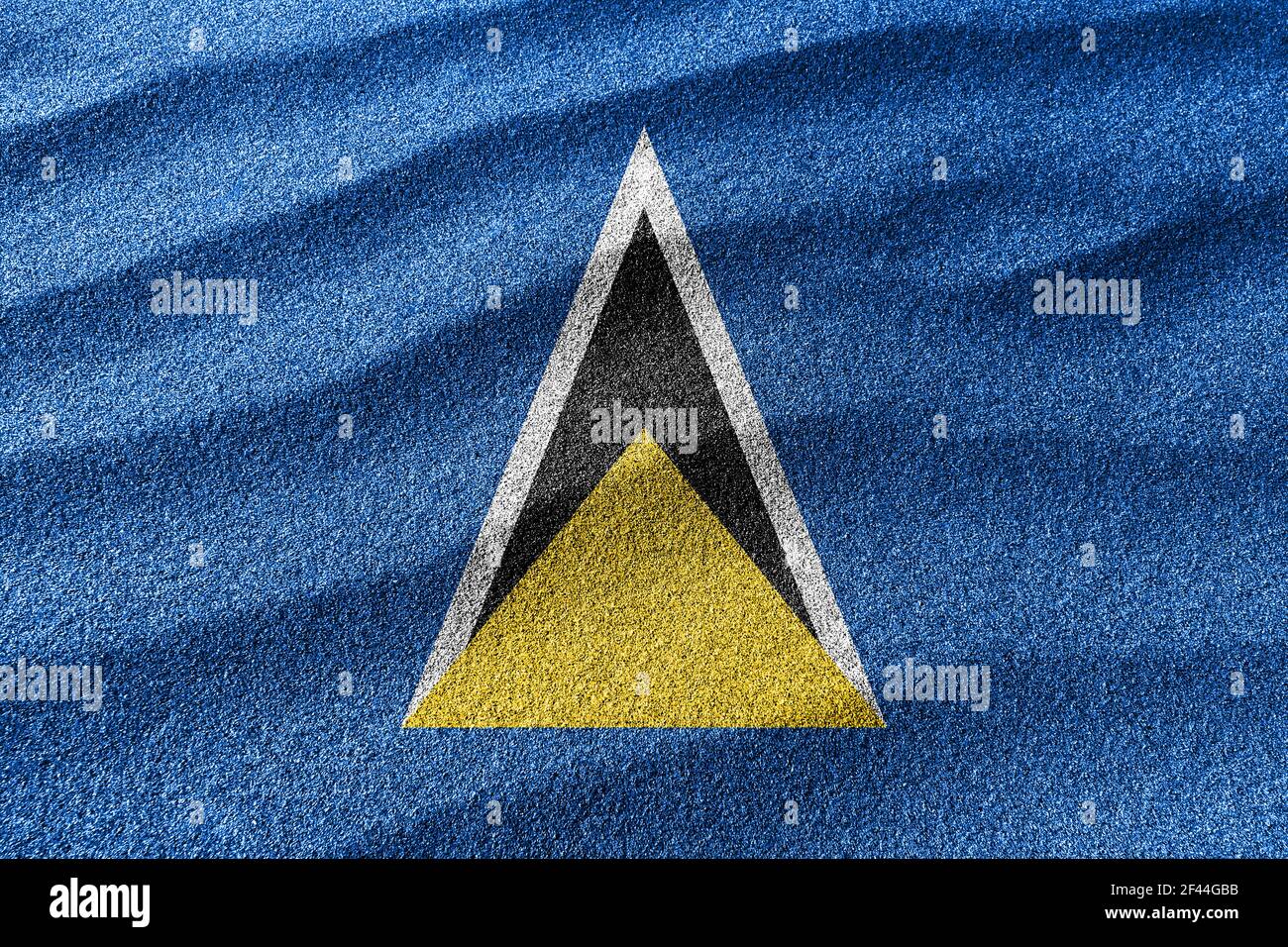 Saint Lucia sand flag, national flag sand background Stock Photo - Alamy