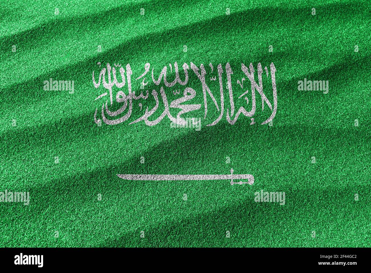 Saudi Arabia sand flag, national flag sand background Stock Photo - Alamy