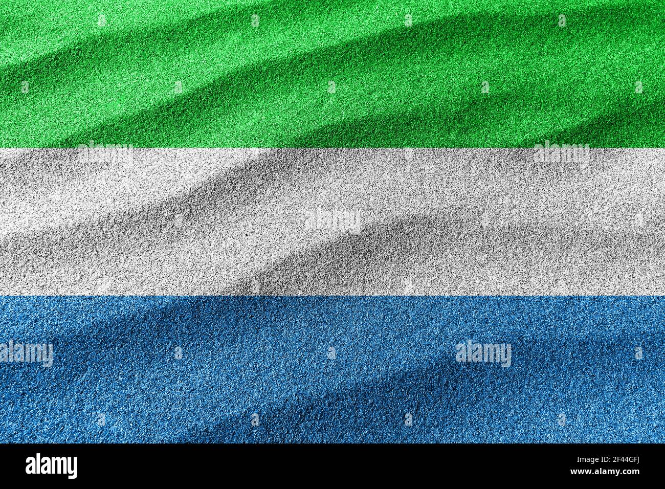 Sierra Leone sand flag, national flag sand background Stock Photo - Alamy