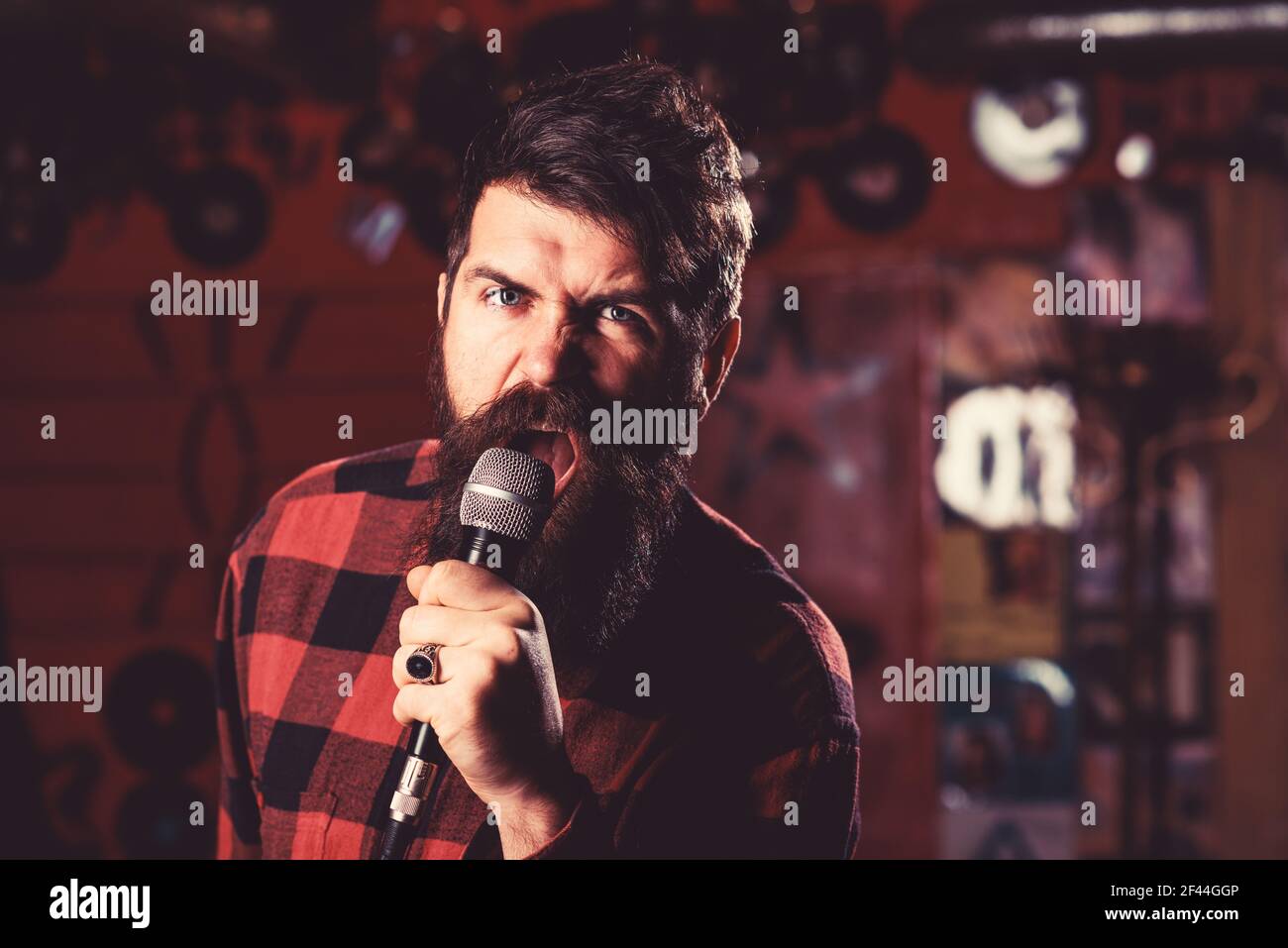 Musician with beard and mustache singing song in karaoke Stock Photo ...