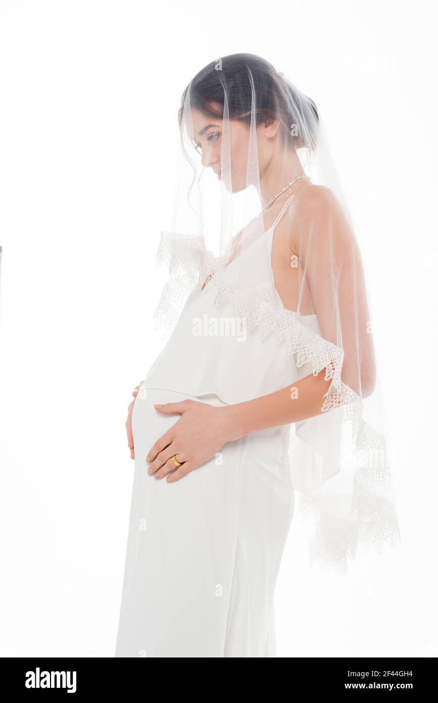 pregnant fiancee in veil touching tummy isolated on white Stock Photo - Alamy