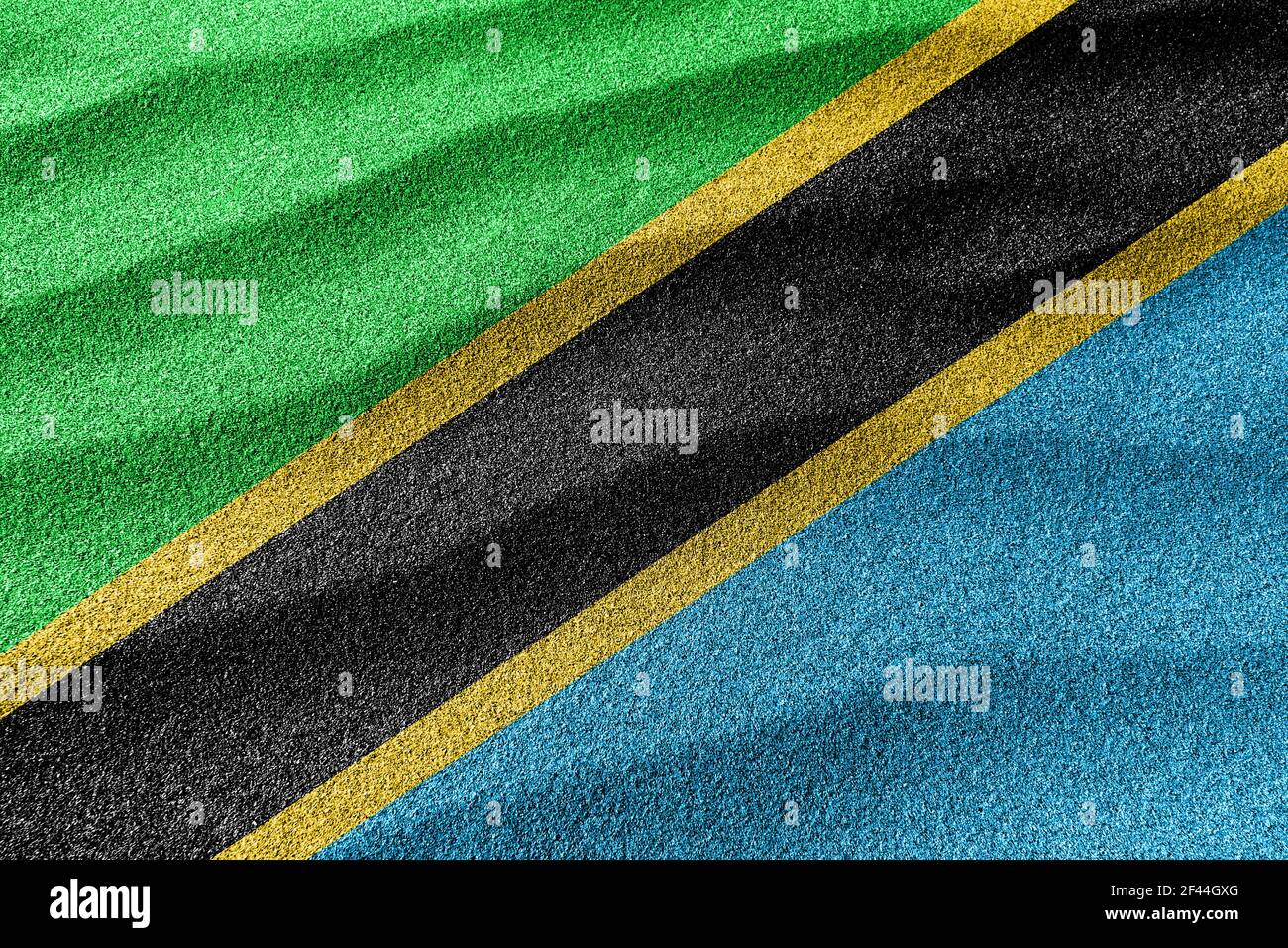 Tanzania sand flag, national flag sand background Stock Photo - Alamy