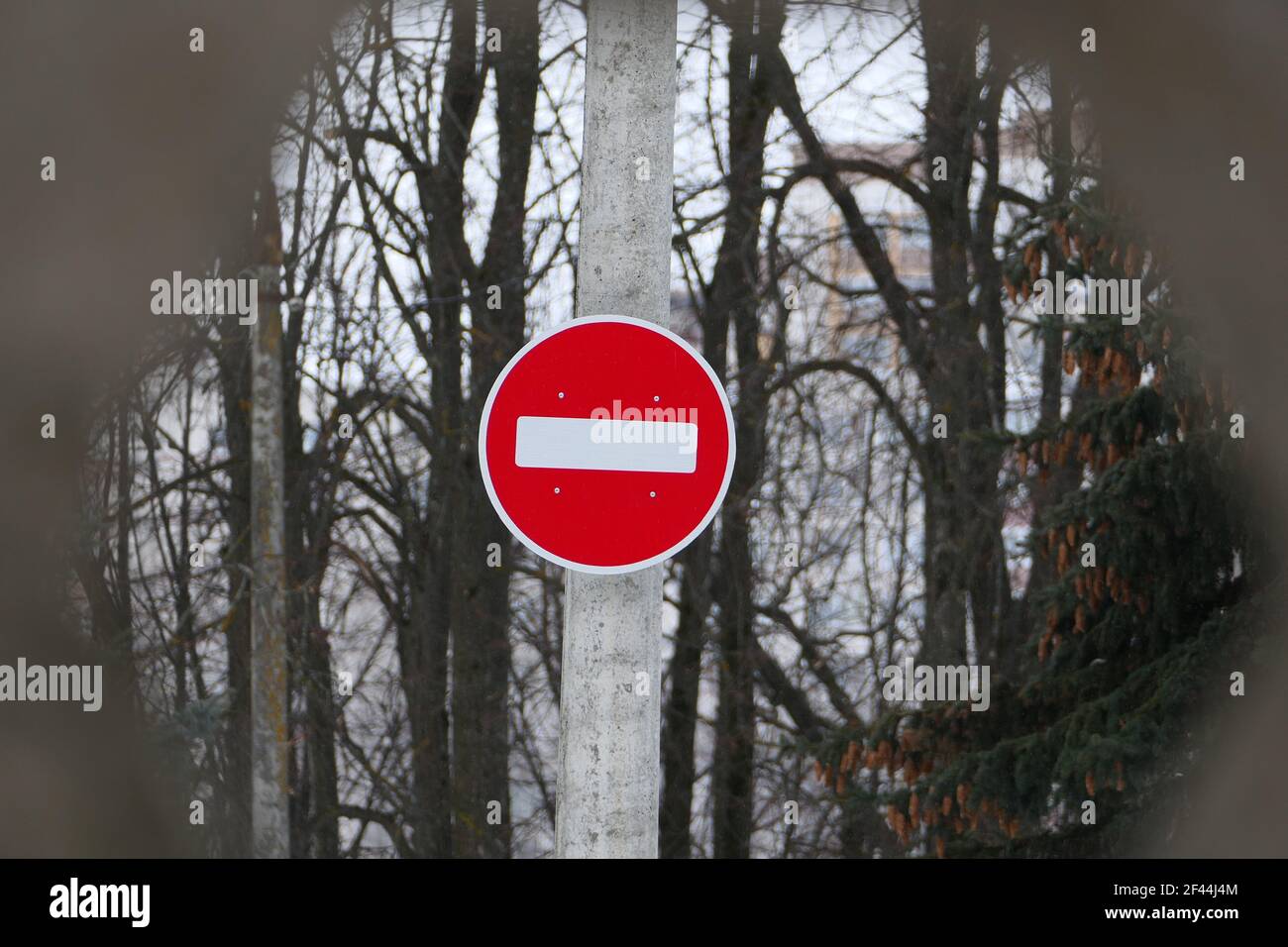 A road sign on a pole. Passage is forbidden, round white on red Stock ...